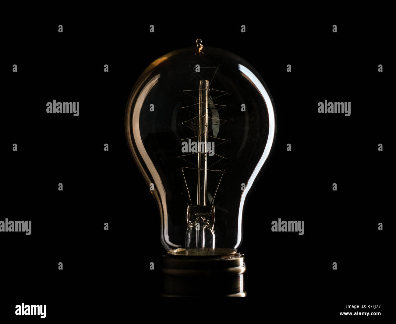 Edison's light bulb illuminates from electric current Stock Photo - Alamy