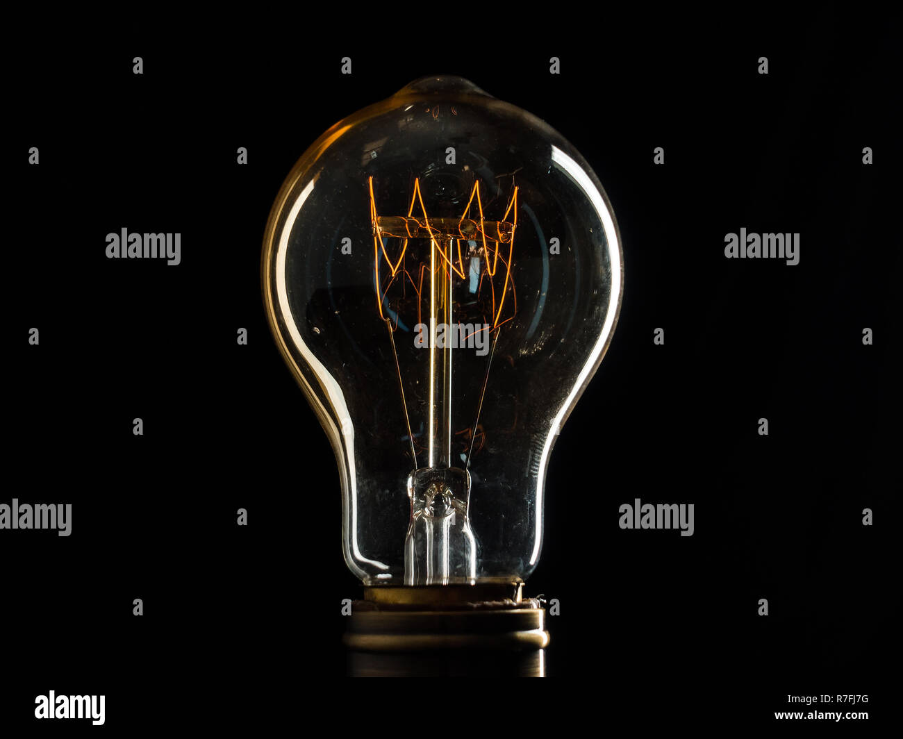 Edison's light bulb illuminates from electric current Stock Photo - Alamy