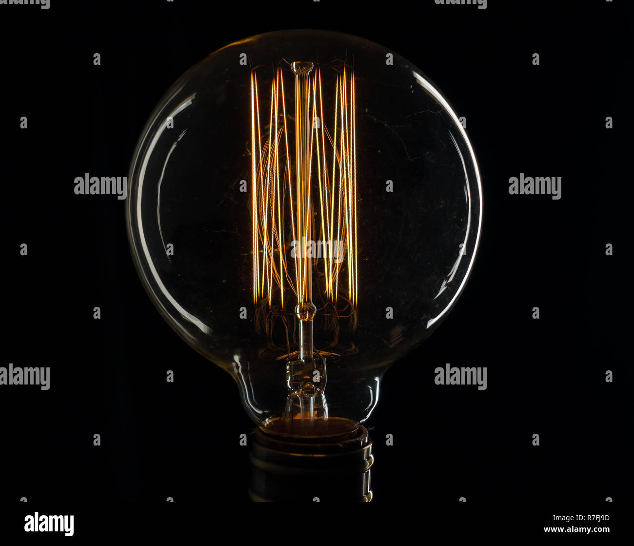 Edison's light bulb illuminates from electric current Stock Photo - Alamy