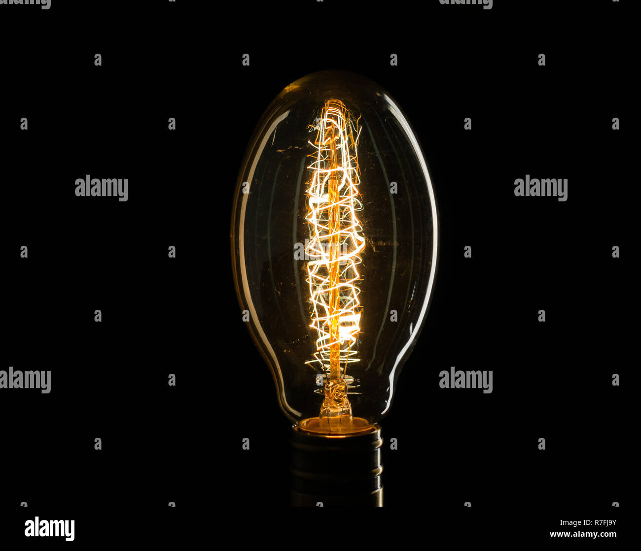 Edison's light bulb illuminates from electric current Stock Photo - Alamy