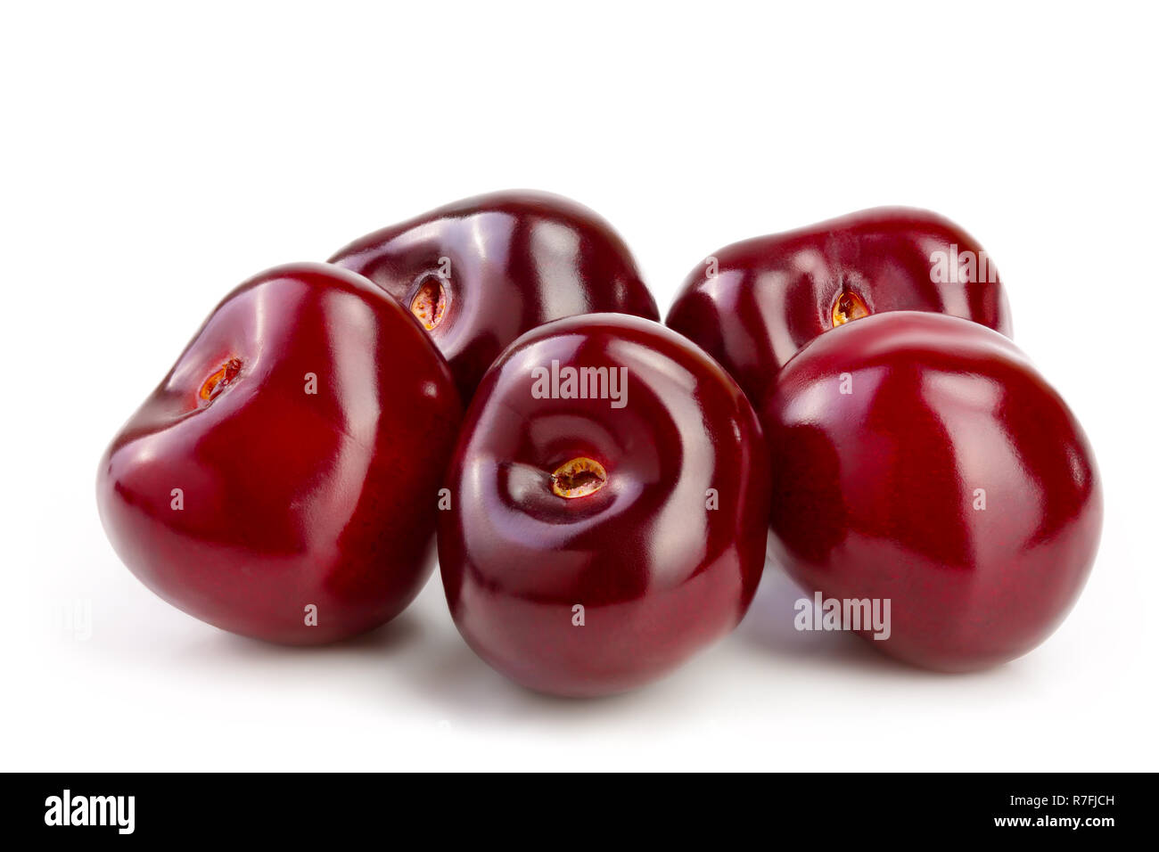 Sweet red cherries isolated on white background macro Stock Photo - Alamy