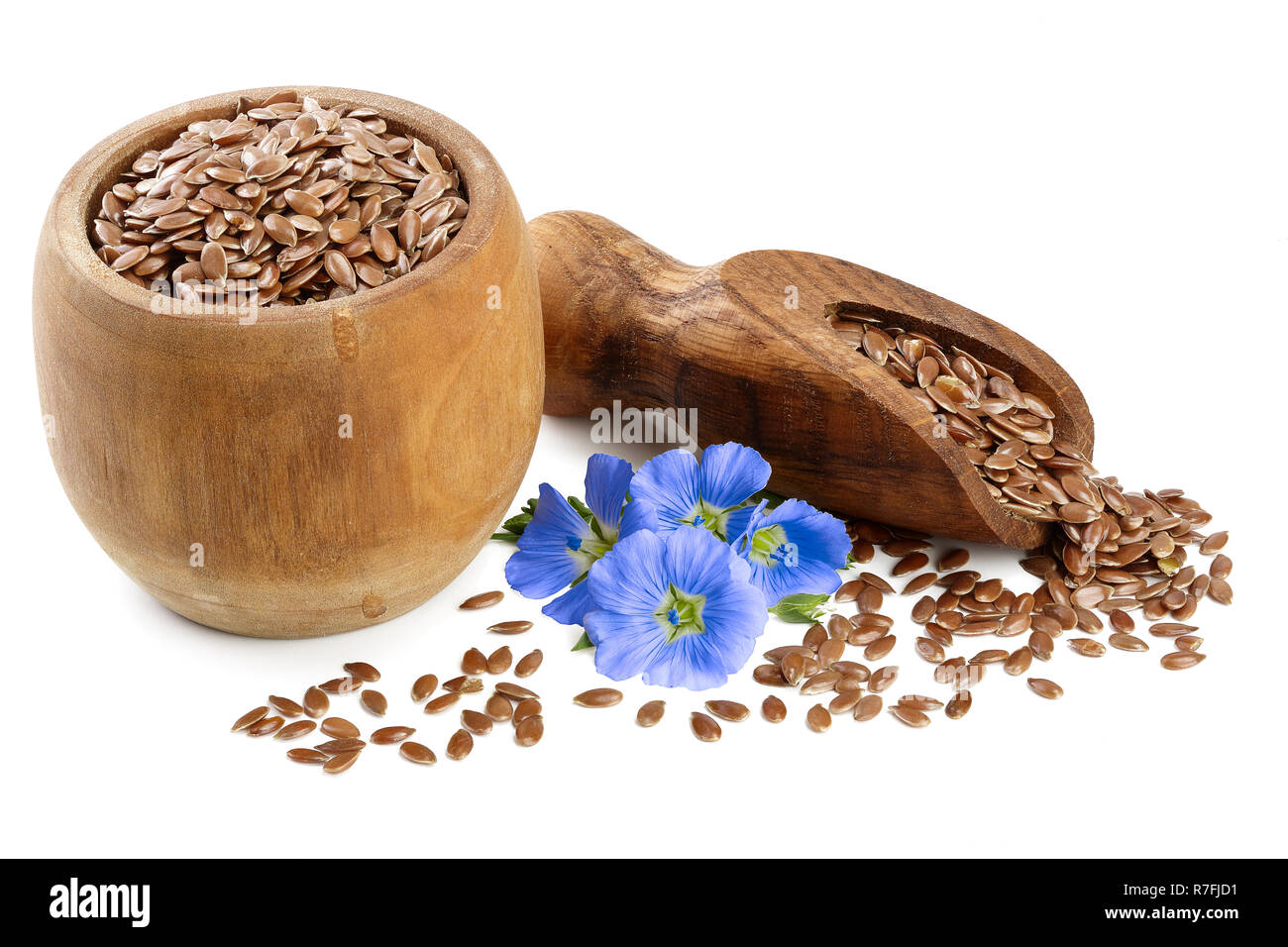 Flax Seeds In Wooden Scoop And Bowl With Flower Isolated On White