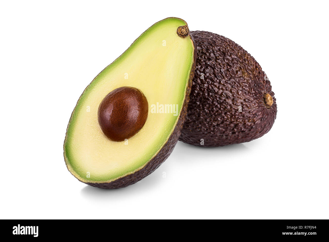 avocado and half isolated on white background Stock Photo - Alamy