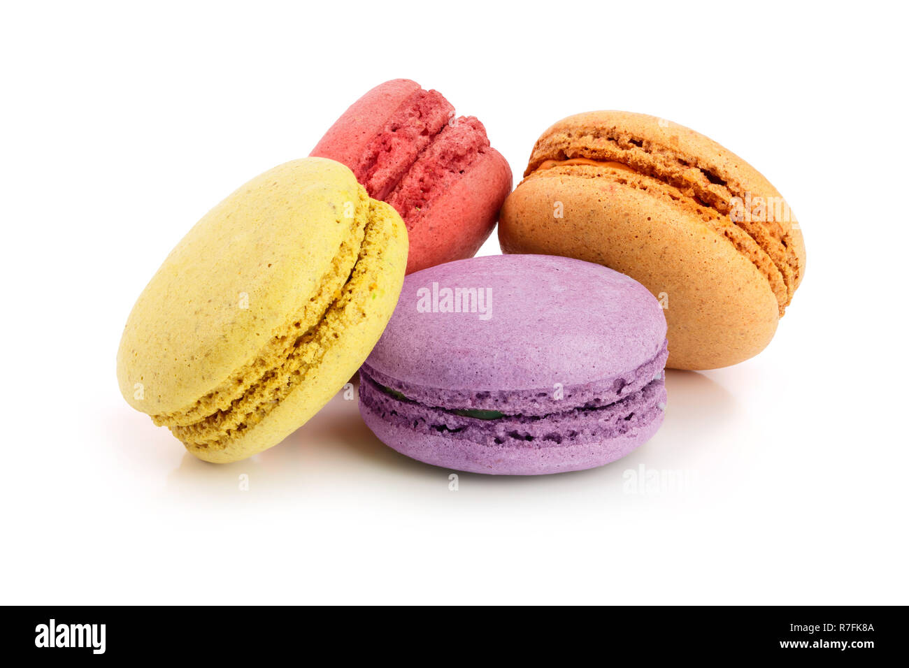 four macaroons isolated on white background closeup Stock Photo - Alamy