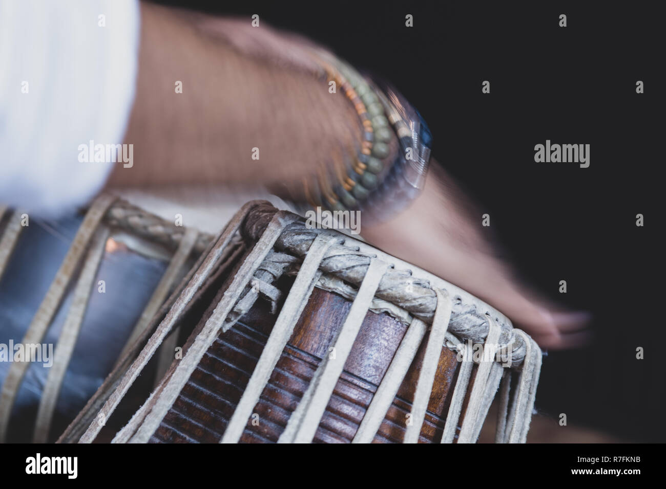Image of a man's hands (wearing beads) playing the Tabla - Indian ...