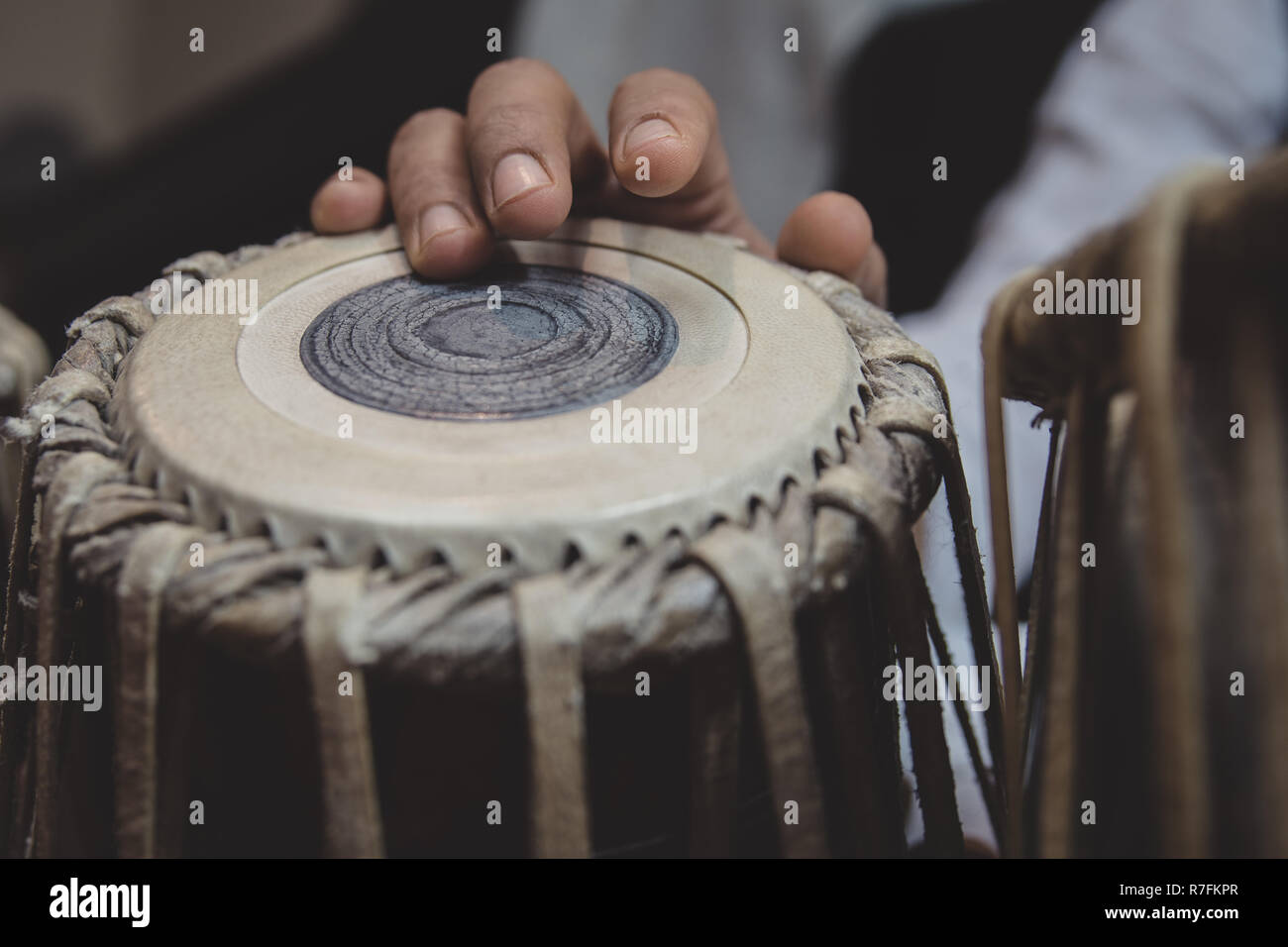 Image of a man's hands (wearing beads) playing the Tabla - Indian ...