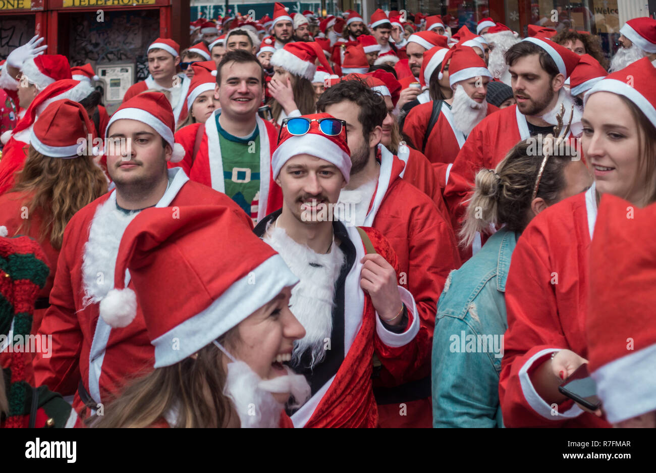 London, UK - December 2018 : Group of people dressed in santa outfits ...