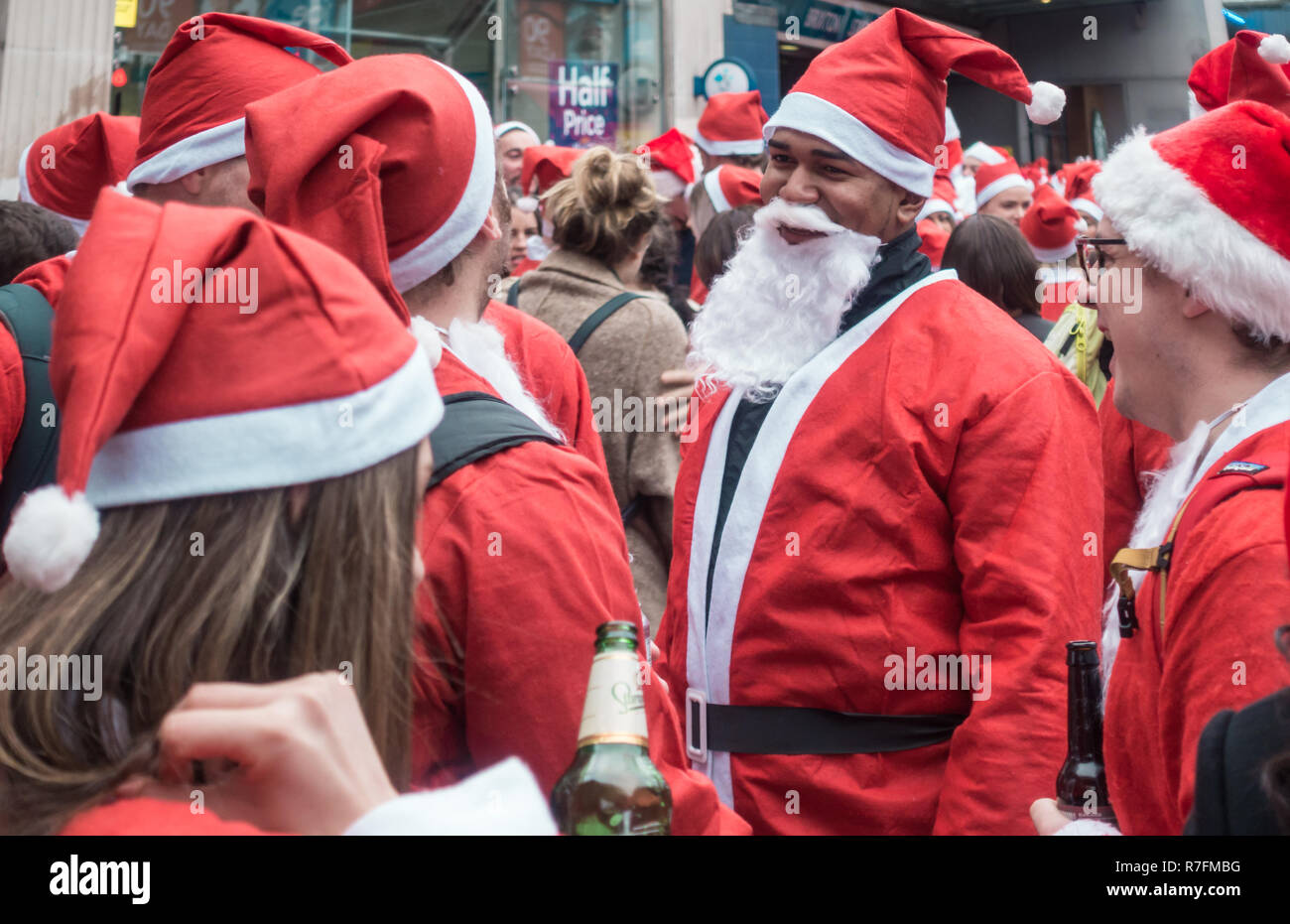 London, UK - December 2018 : Group of people dressed in santa outfits ...