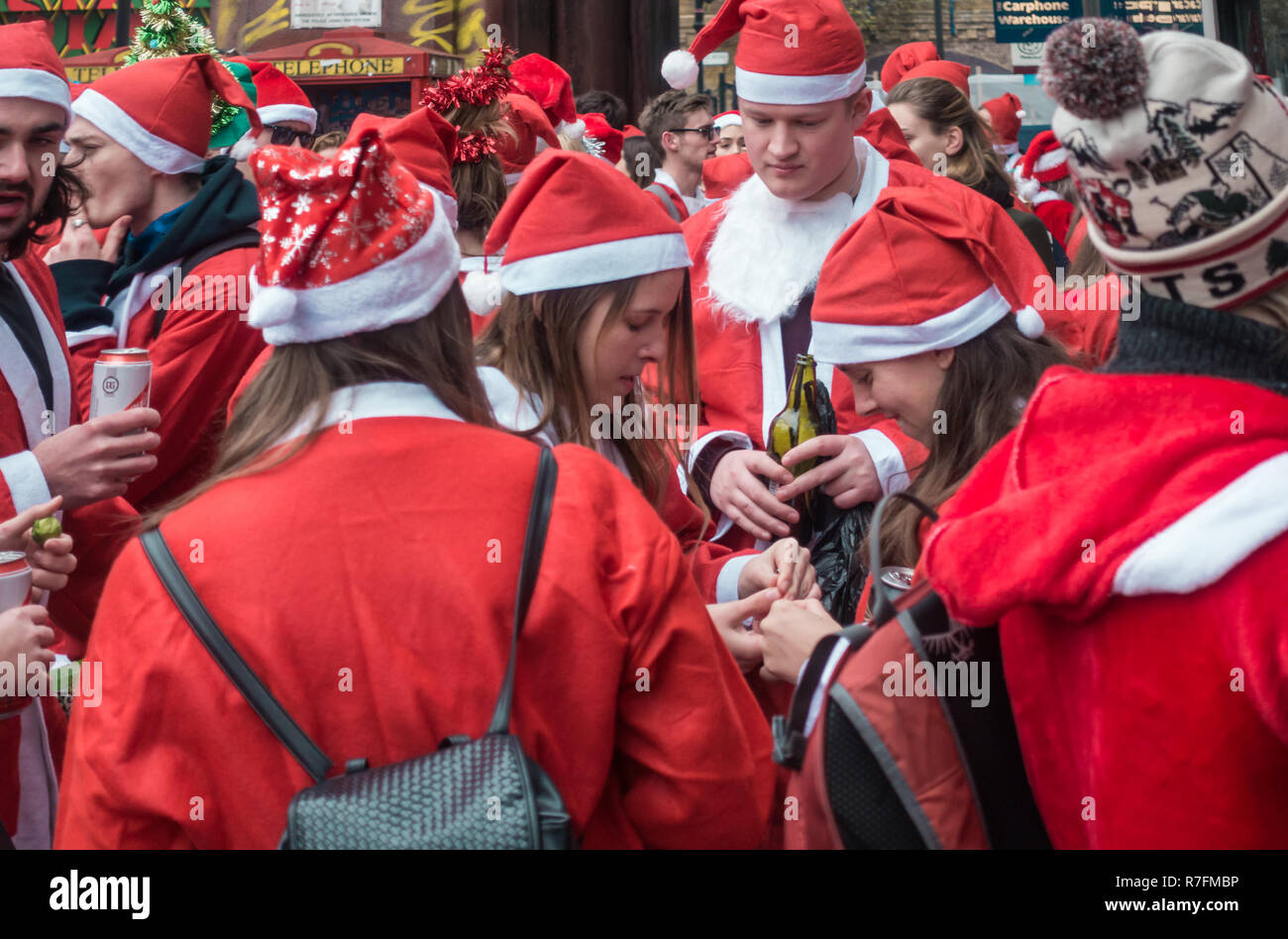 London, UK - December 2018 : Group of people dressed in santa outfits ...