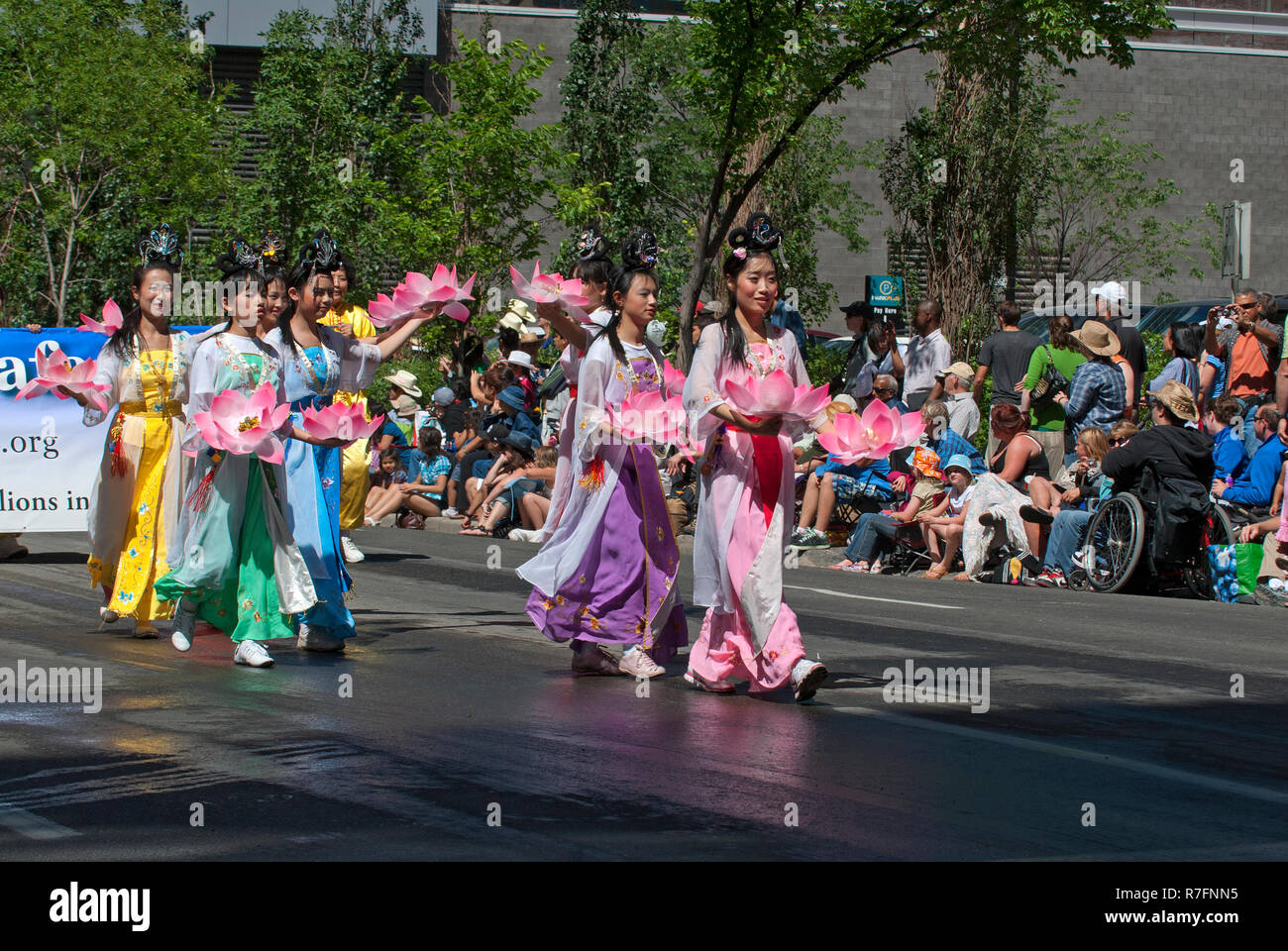Chinese young women in traditional dresses during the Calgary Stampede ...