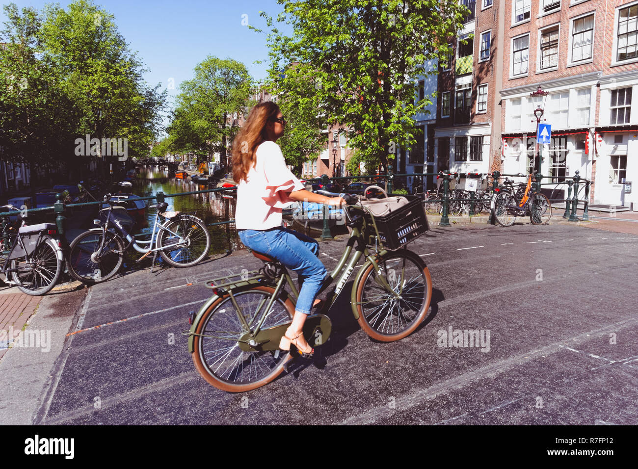 Woman riding bike amsterdam hi-res stock photography and images - Alamy