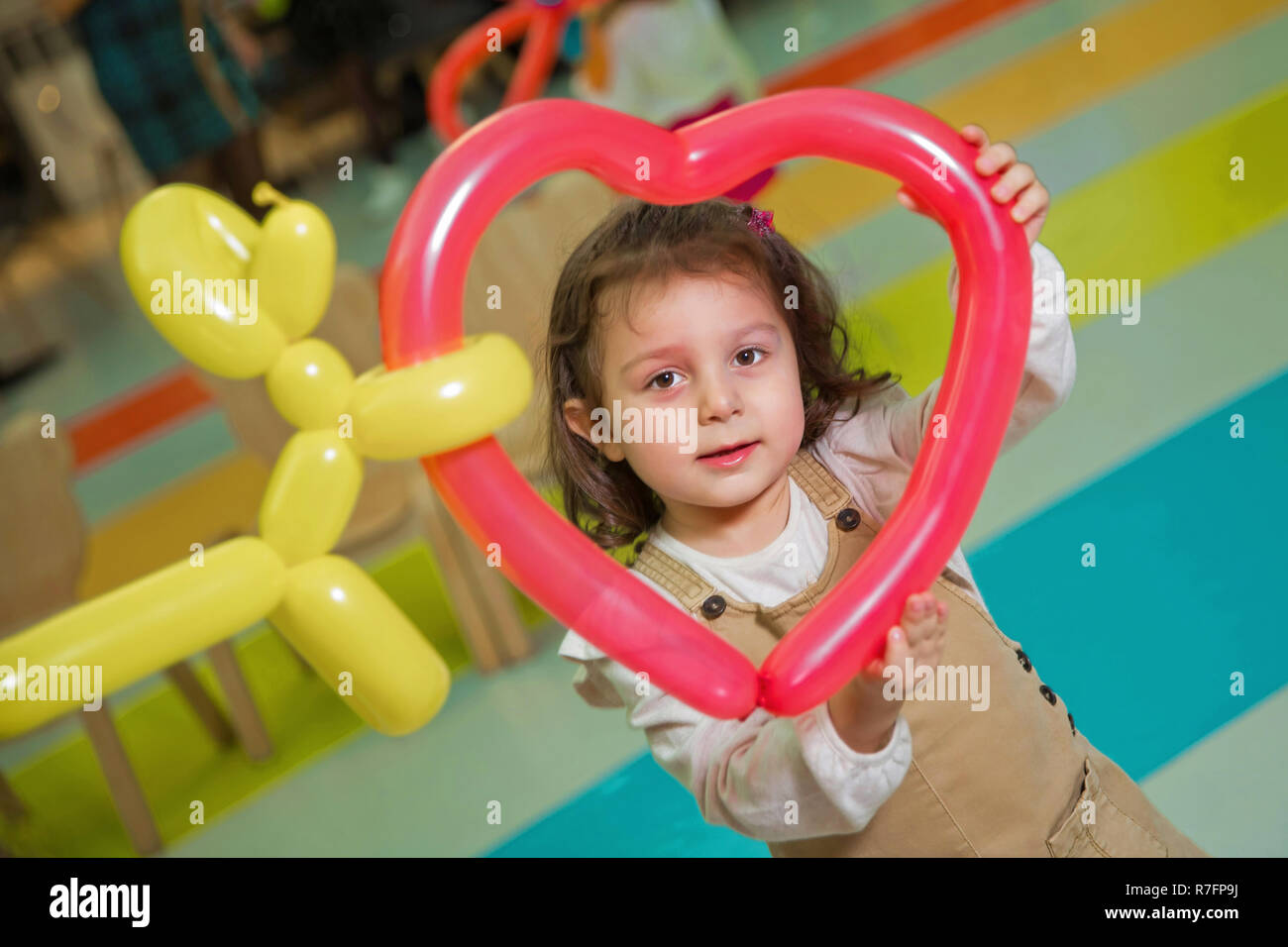 The child draws a red heart and draws a picture . Long heart-shaped ...