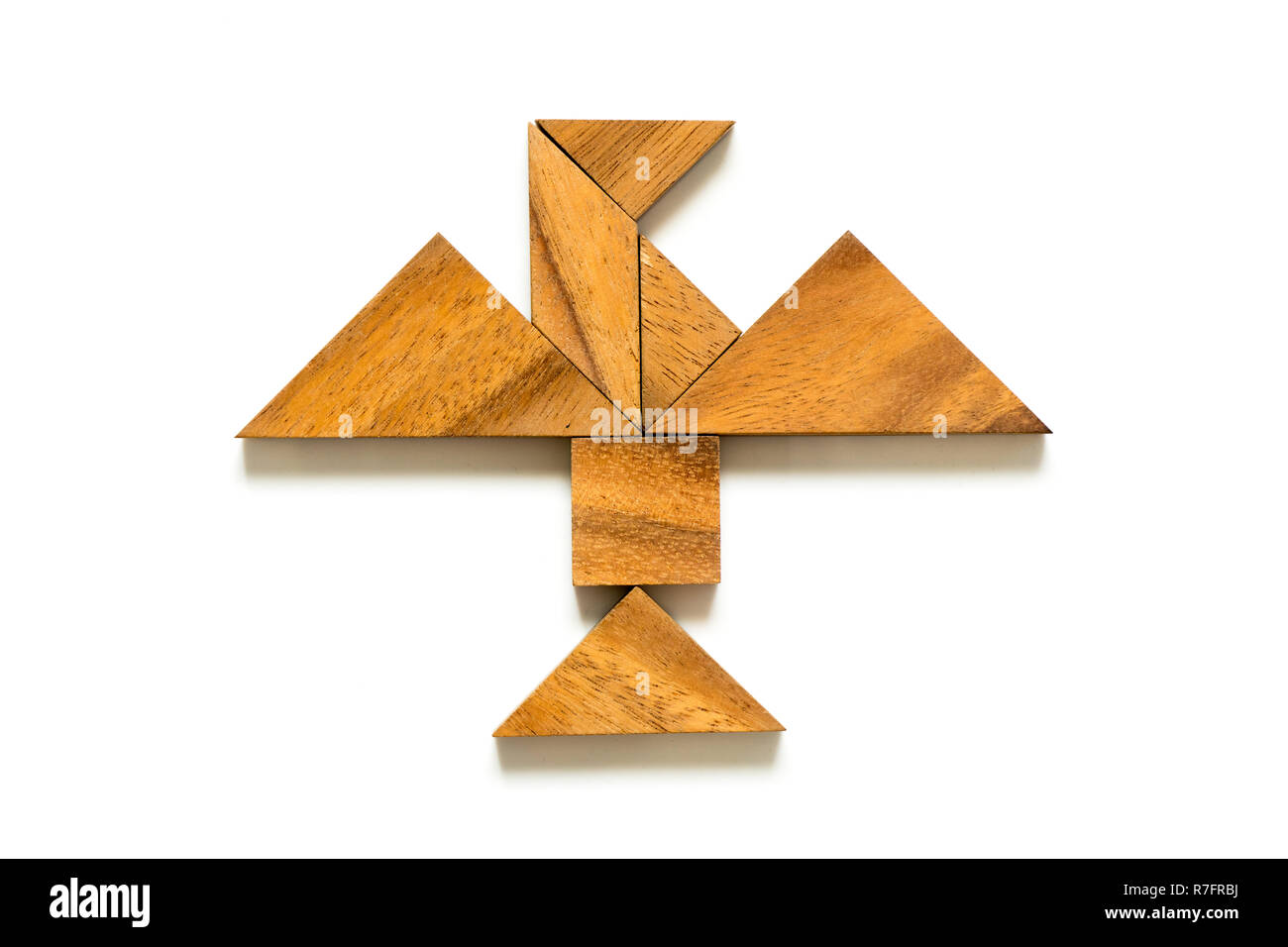 Wood tangram puzzle in flying bird shape on white background Stock ...