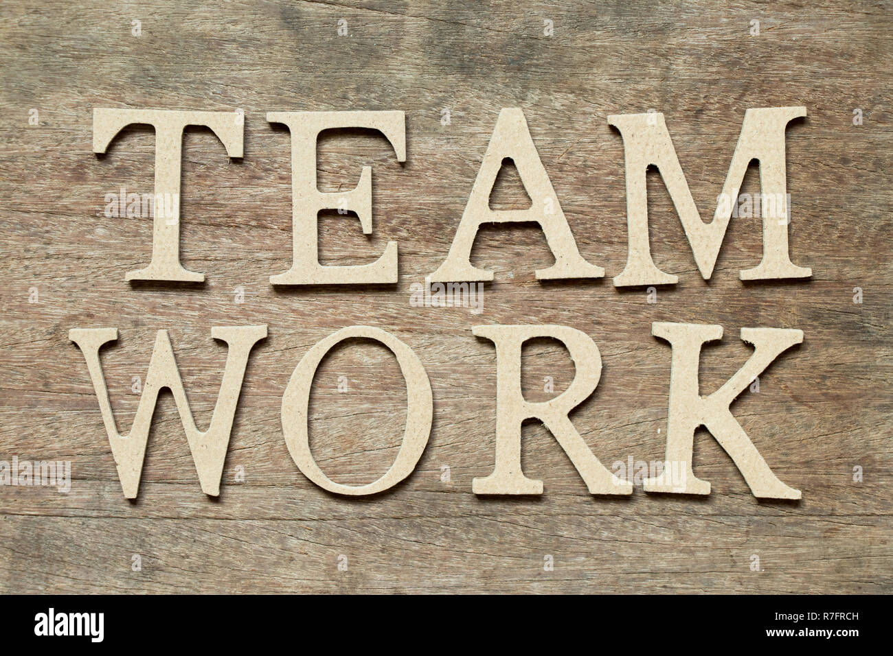 English alphabet in word teamwork on wood background Stock Photo - Alamy