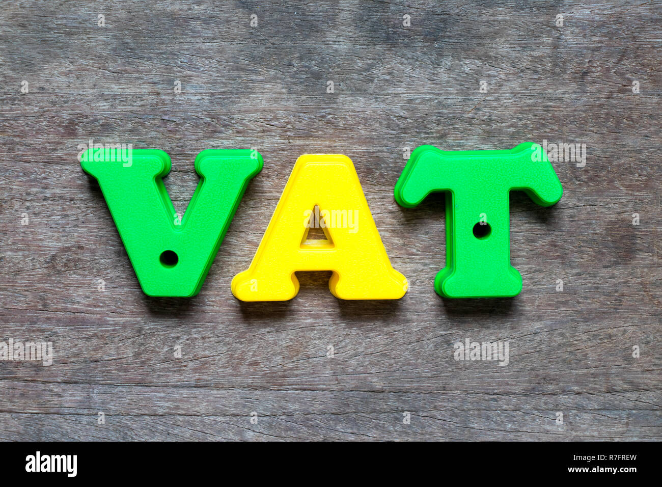 Color alphabet in word VAT (value added tax) on wood background Stock ...
