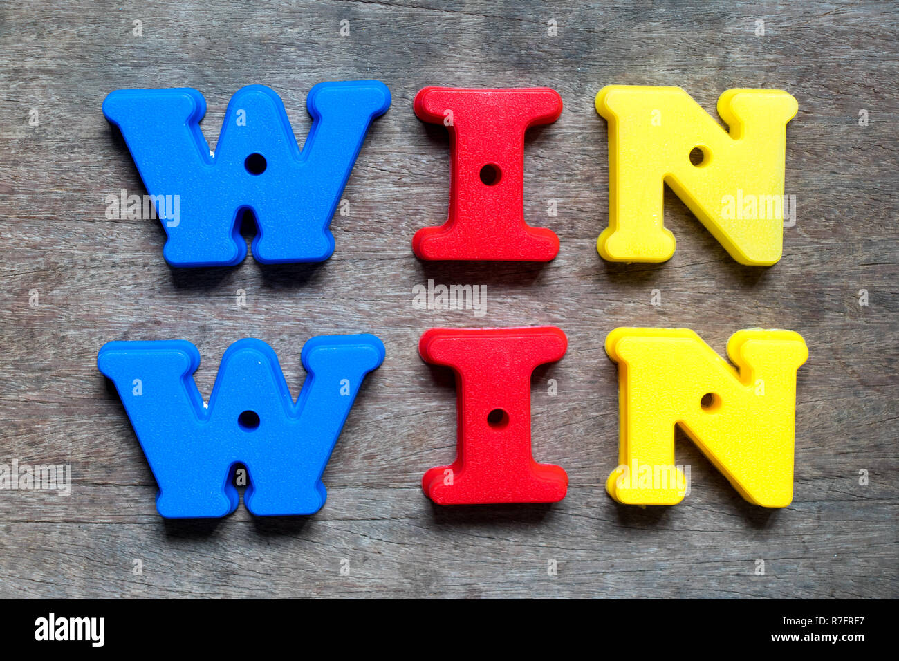 Color alphabet in word win win on wood background Stock Photo - Alamy