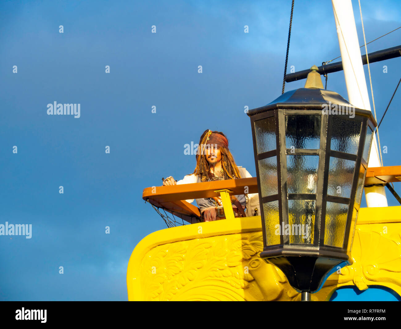 Sailor in pirate costume on the aft deck of the visitor attraction a ...