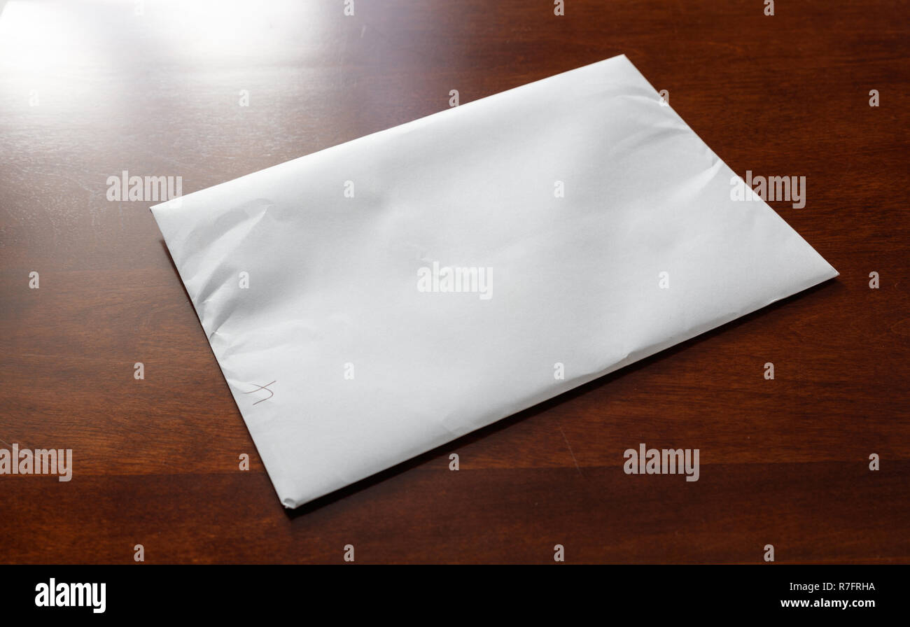 White Business Mail on wood table Stock Photo - Alamy