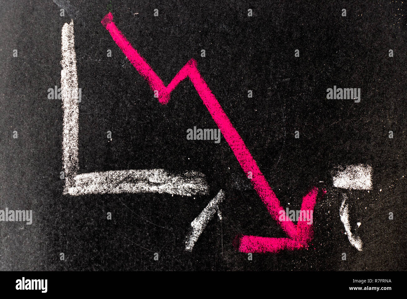 Red chalk drawing in down trend arrow break the graph line shape on ...
