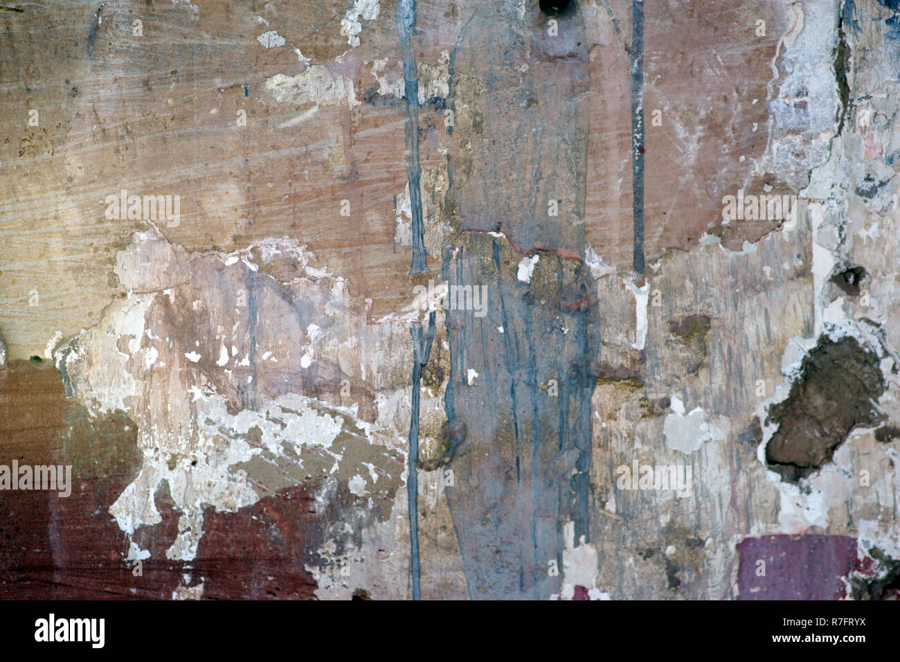 The close-up of a house wall with paint splashes and repair points ...
