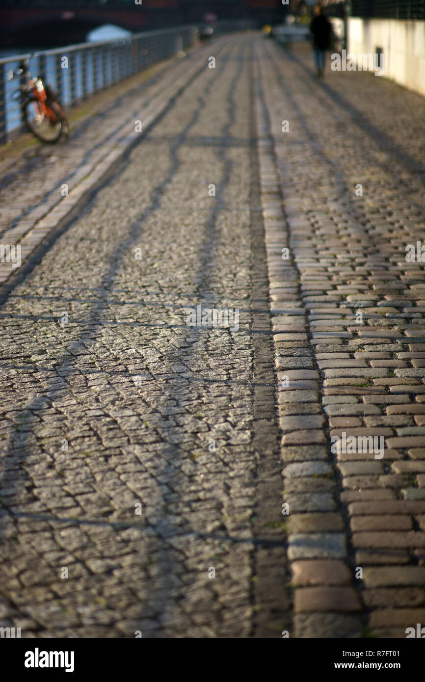 The closeup of a walkway with the shadows of a railing Stock Photo - Alamy