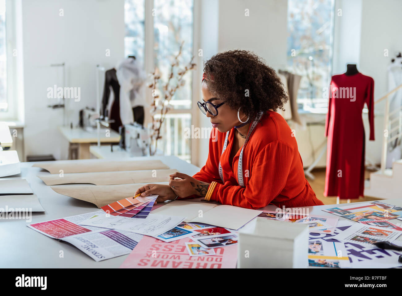 Unusual good-looking female design being busy looking for color Stock ...