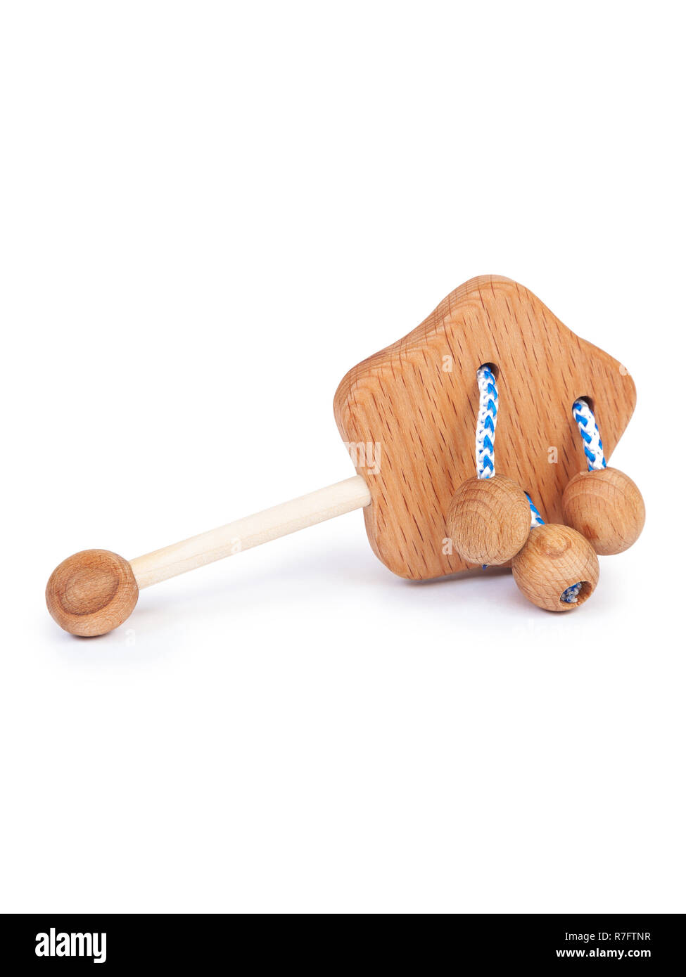 Photo of wooden rattles in the shape of a star on a white isolated ...