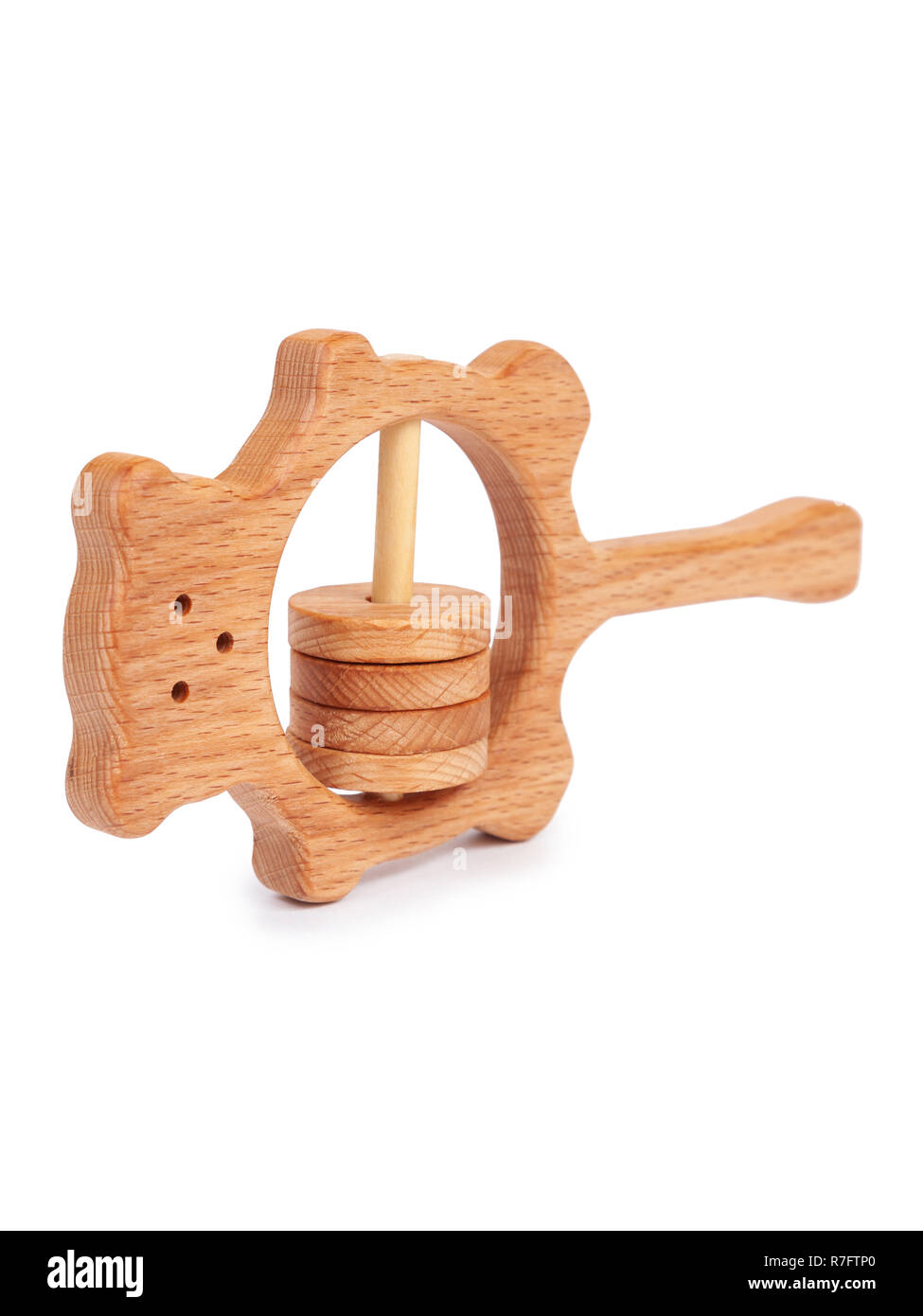 Photo of wooden rattles in the shape of a bear on a white isolated ...