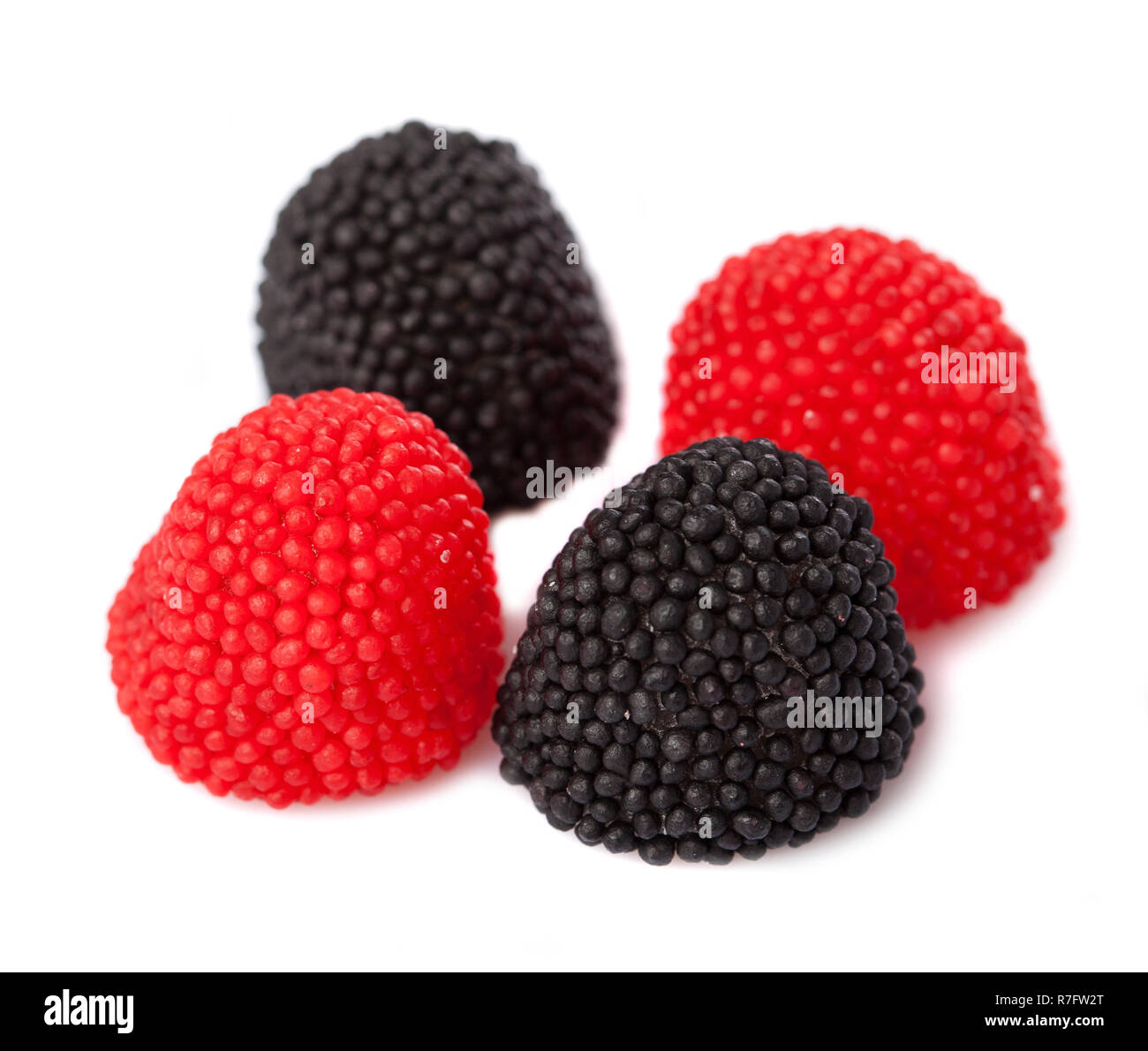 black and red candy blackberries on a white background Stock Photo - Alamy