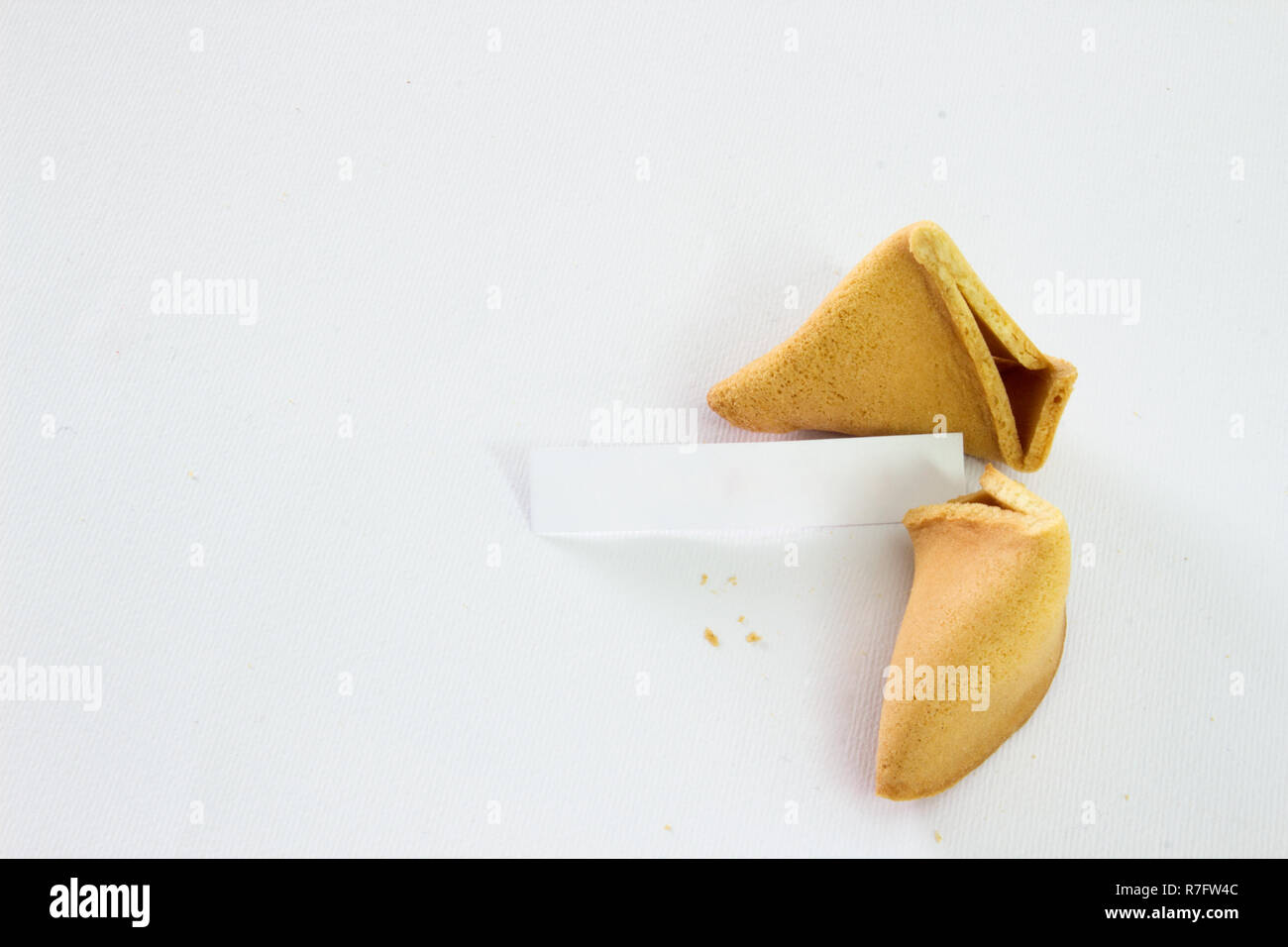 Broken fortune cookies with blank slip isolated on white background ...