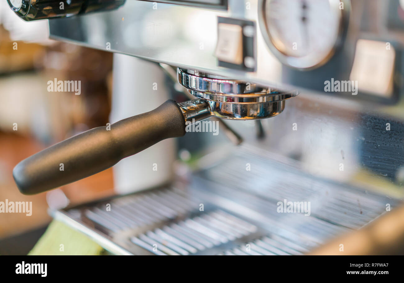 Espresso pouring from coffee machine hi-res stock photography and ...