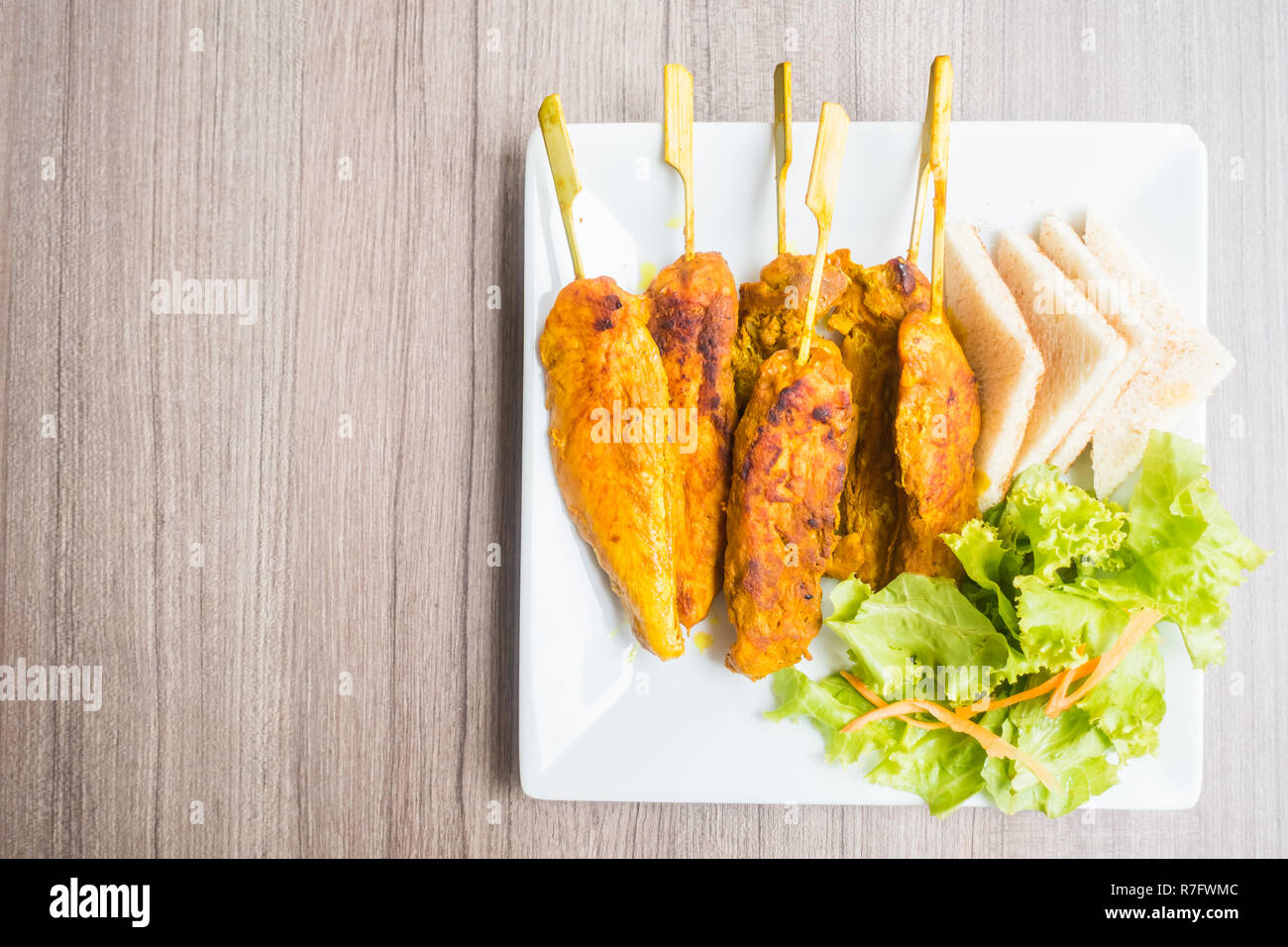 Grilled Chicken satay in white plate Stock Photo - Alamy