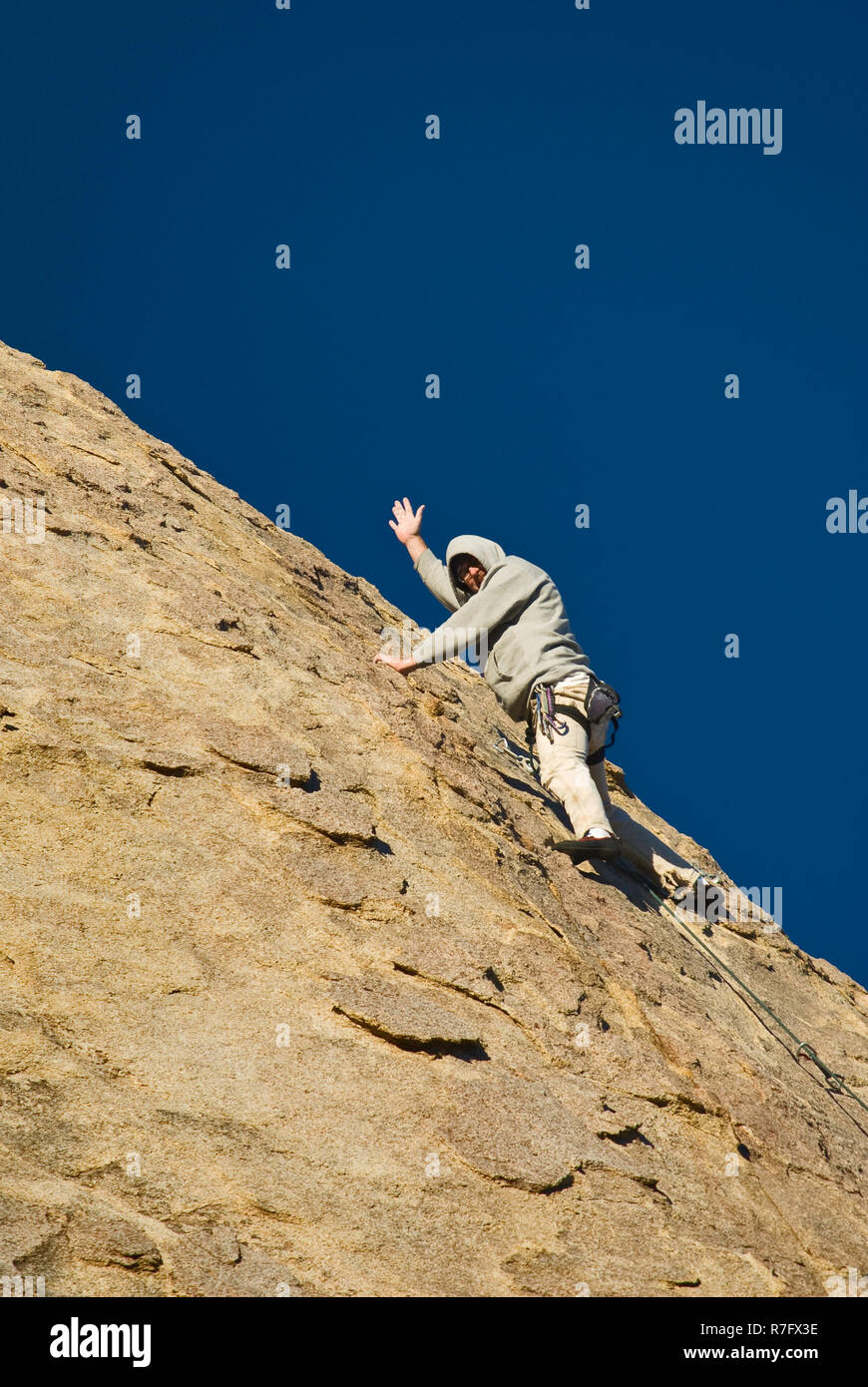 Rock climber scaling exposed rock face in Alabama Hills near Lone Pine ...