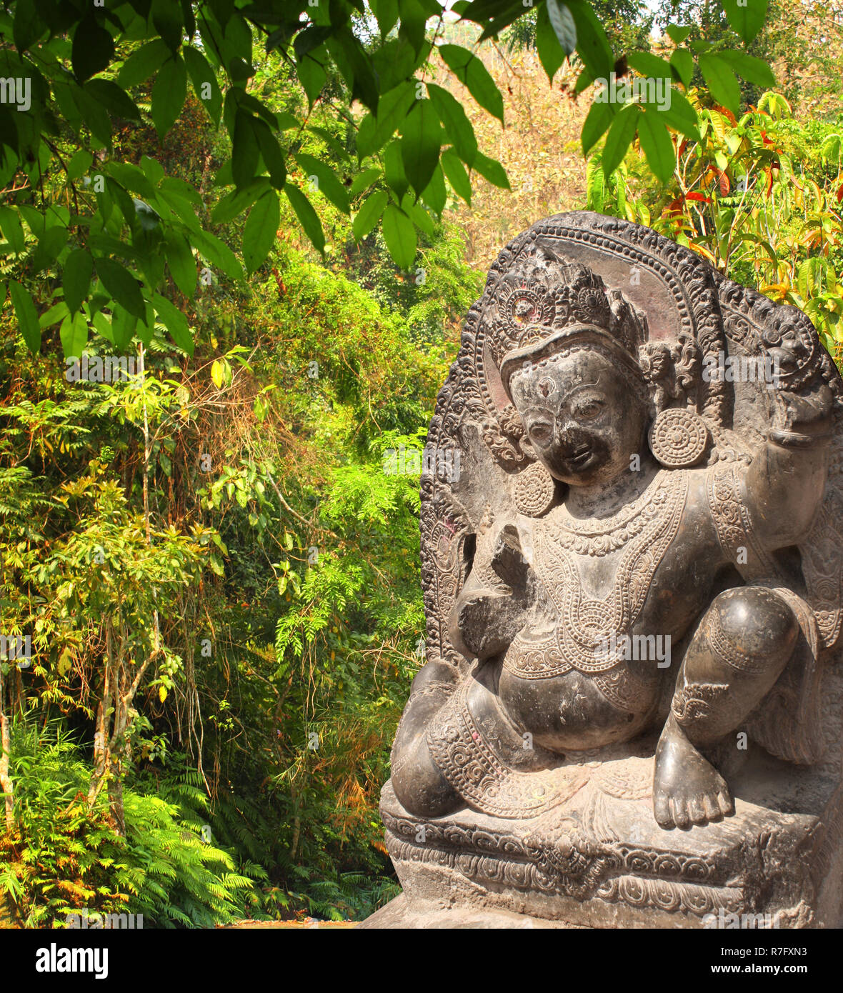 Stone sculpture of dancing hindu god and trees in rainforest Stock ...