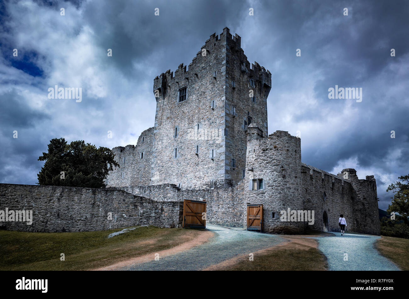 Tourist visiting the 15th century Ross Castle on a perfect moody day ...