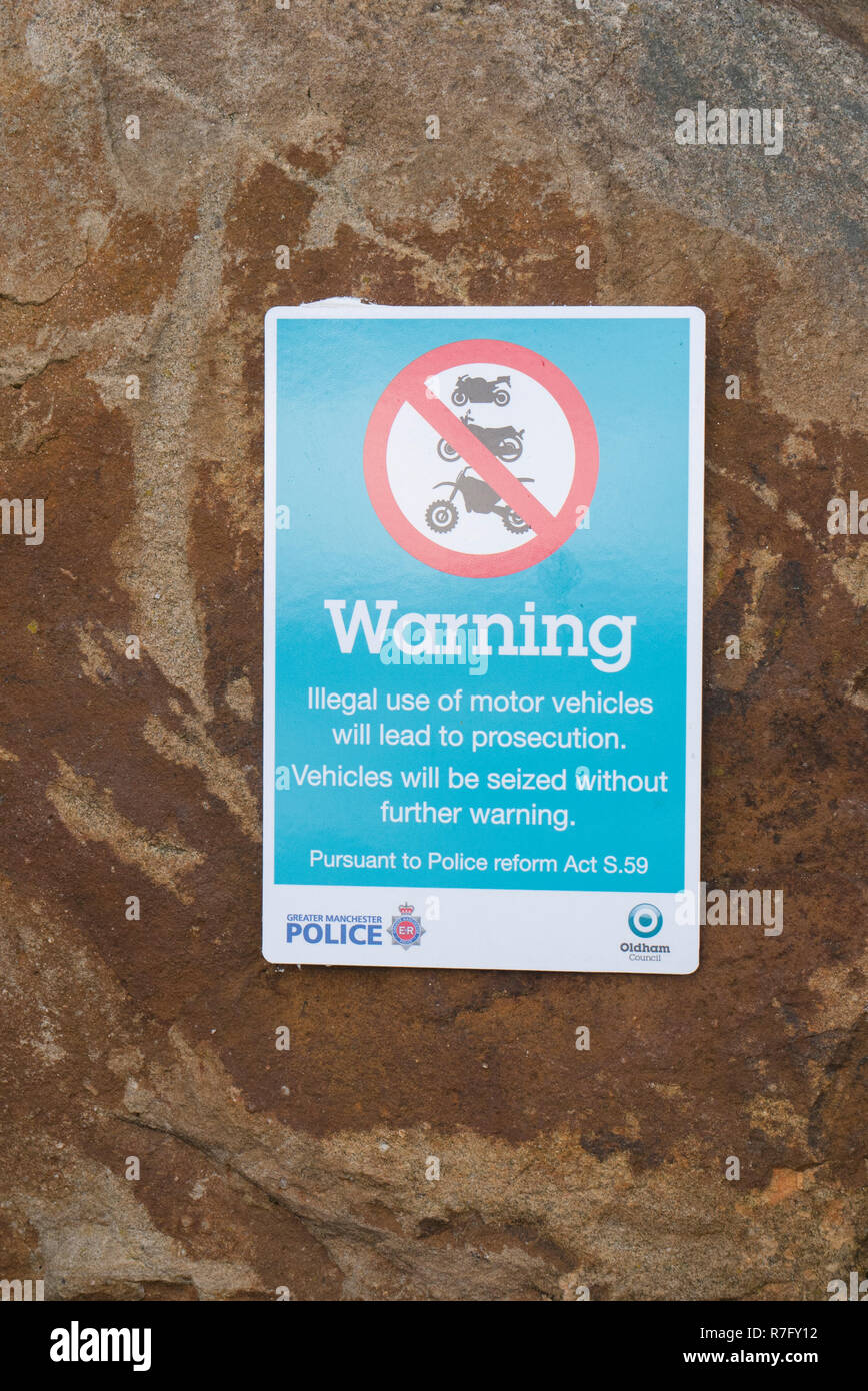 Police warning notice on a boulder in the middle of a country track ...
