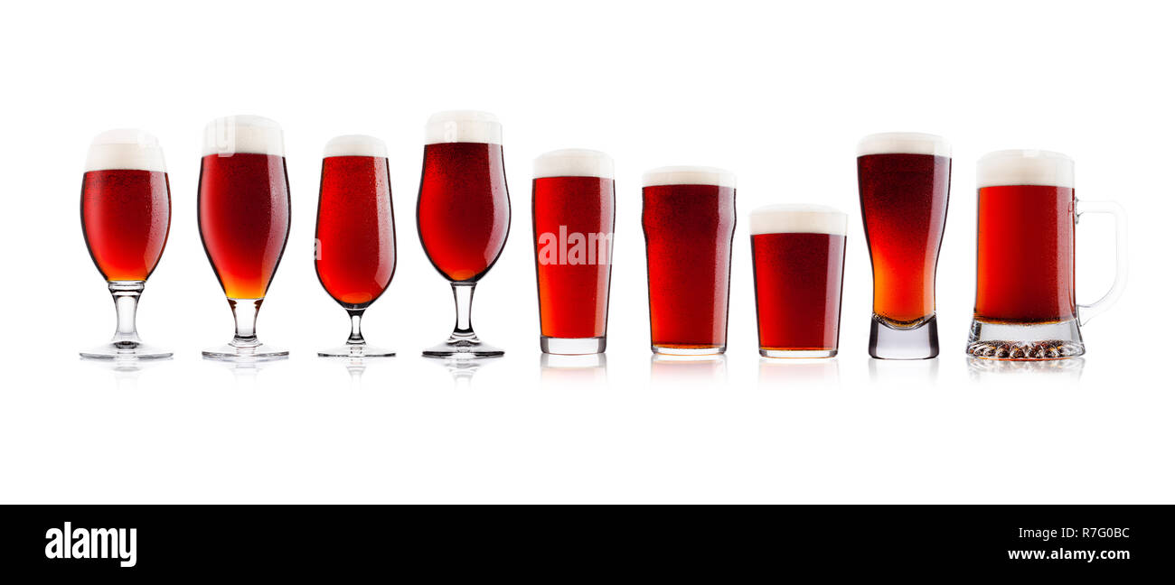 Cold glass of red bitter ale beer with foam and dew isolated on white ...