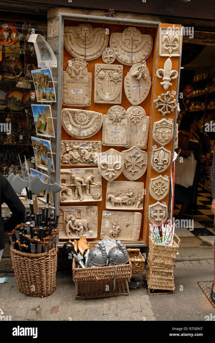 A souvenir/ gift shop in a narrow medieval street lined with other ...