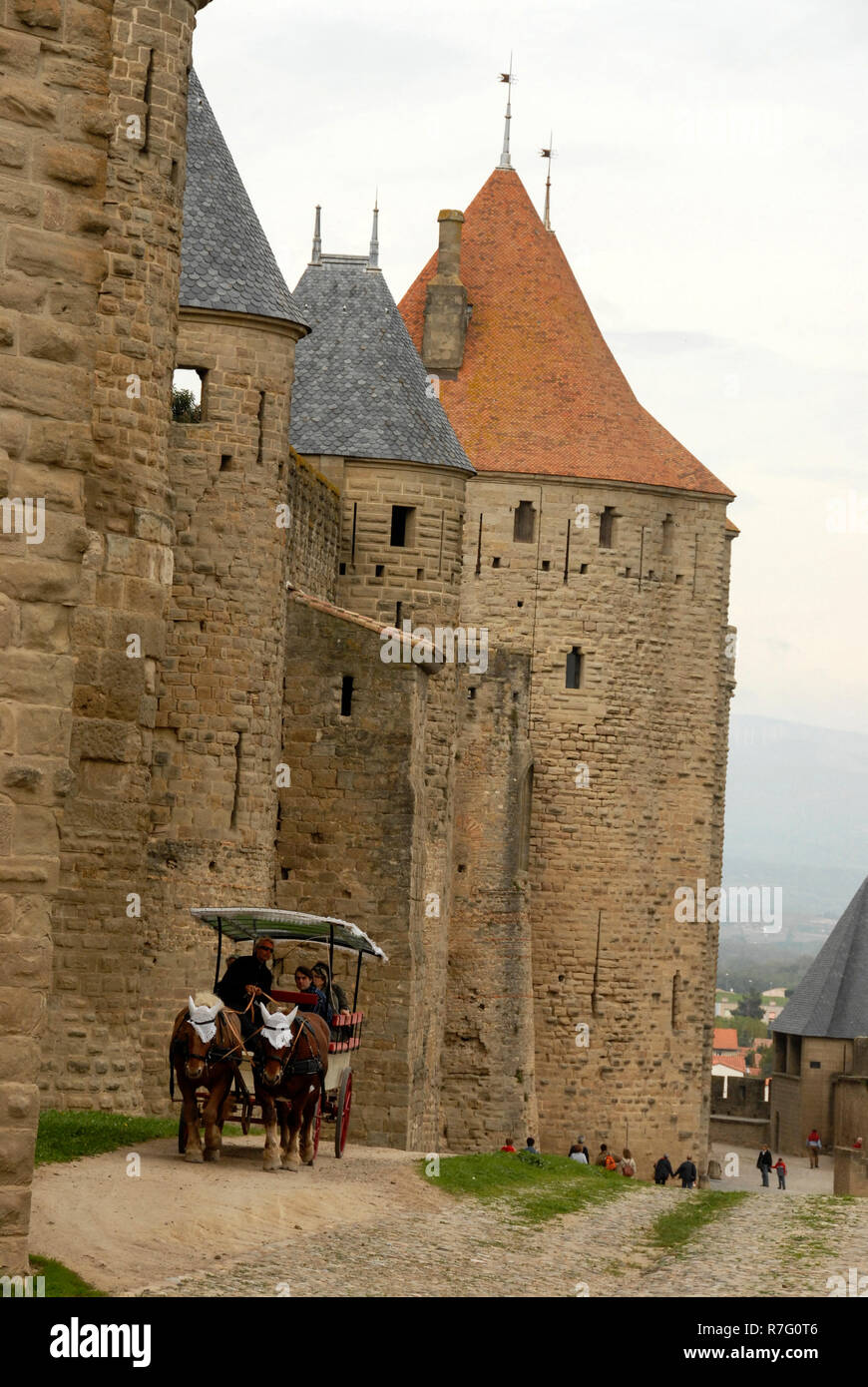 A horse and carriage carrying tourist on a guided tour around the inner ...