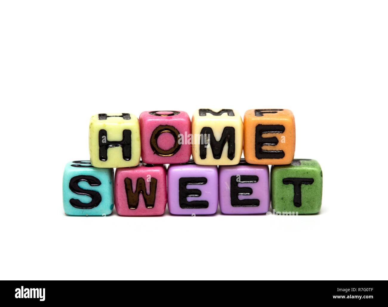sweet home - word made from multicolored child toy cubes with letters ...