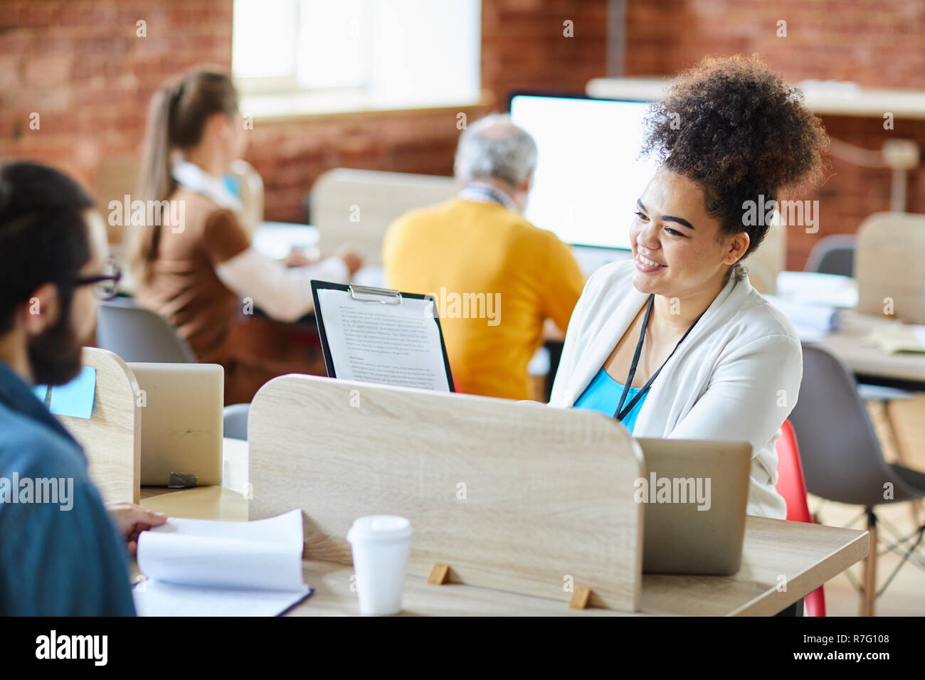Discussing working questions Stock Photo - Alamy