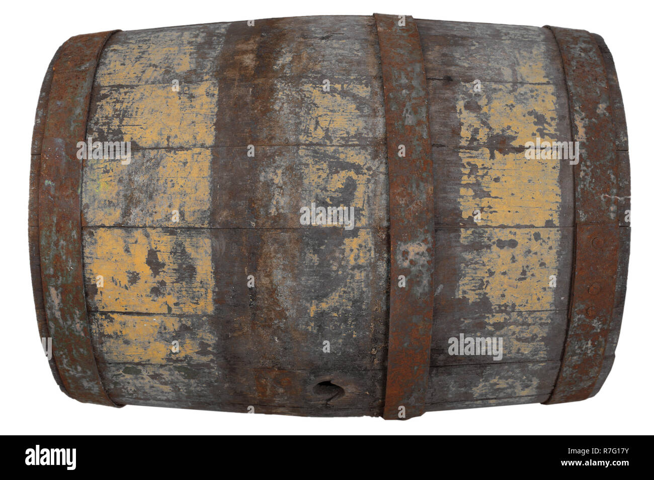 old rusty wooden barrel with remnants of yellow paint isolated on white ...