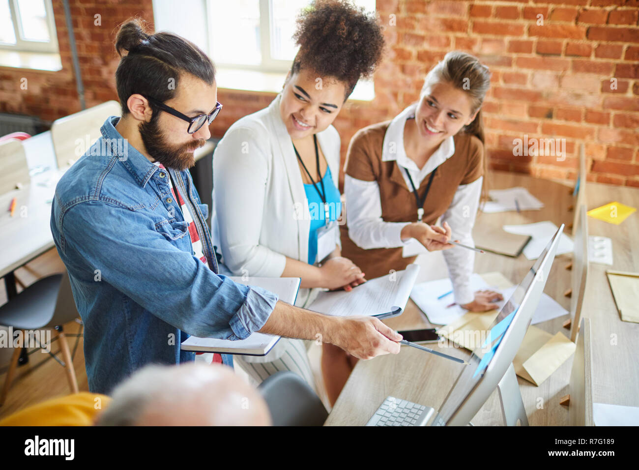 Colleagues discussing data Stock Photo - Alamy