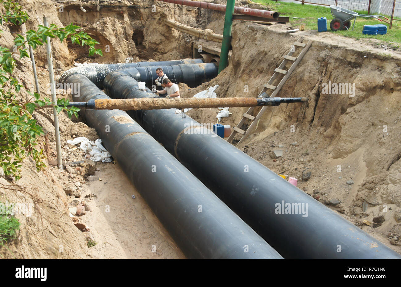 Construction work. Pipe laying. Repair of communications Stock Photo ...