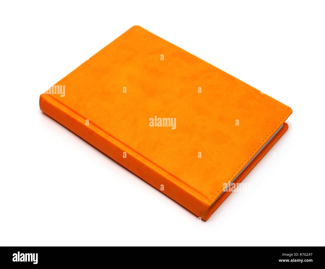orange notebook isolated on a white background Stock Photo - Alamy