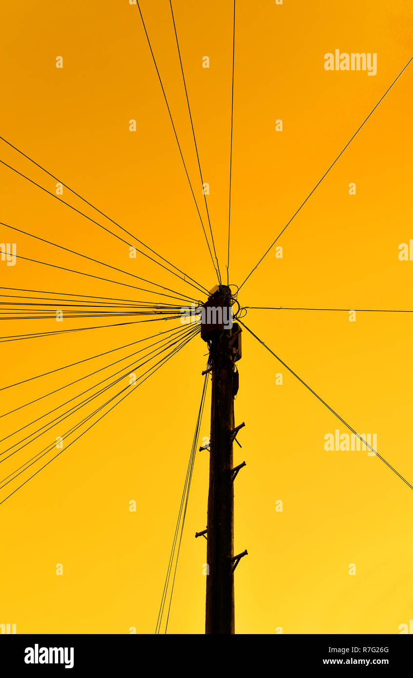 Power comms cables and telegraph pole at sunset Stock Photo - Alamy