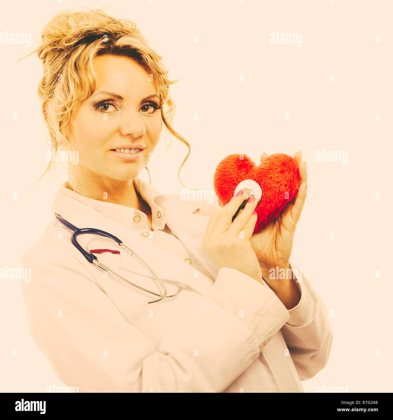 Medical examination of cardiology. Middle aged cardiologist with heart ...