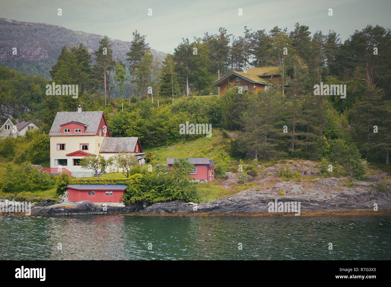 traditional norwegian wooden house to stand at the lakeside and ...