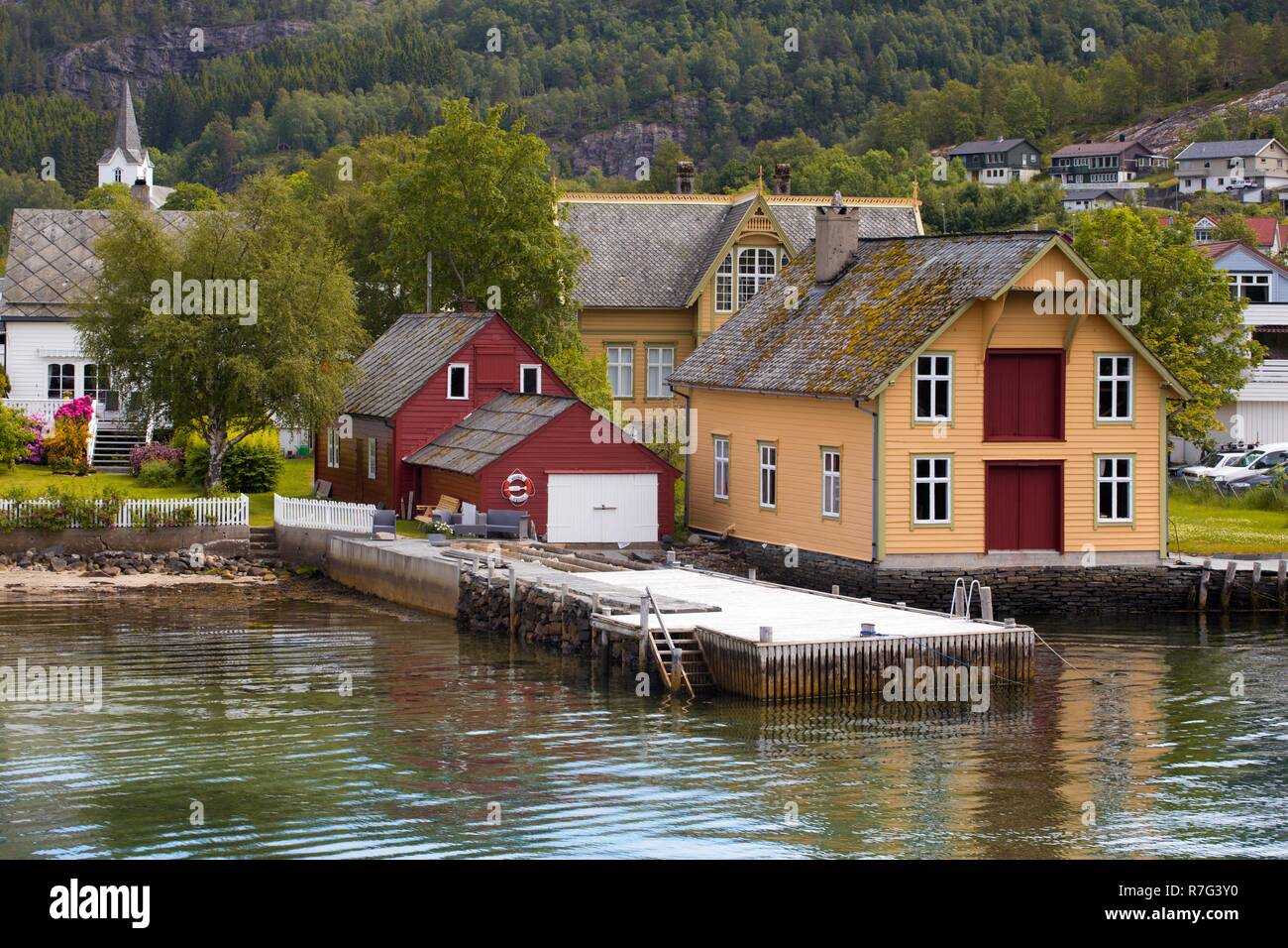 traditional norwegian wooden house to stand at the lakeside and ...