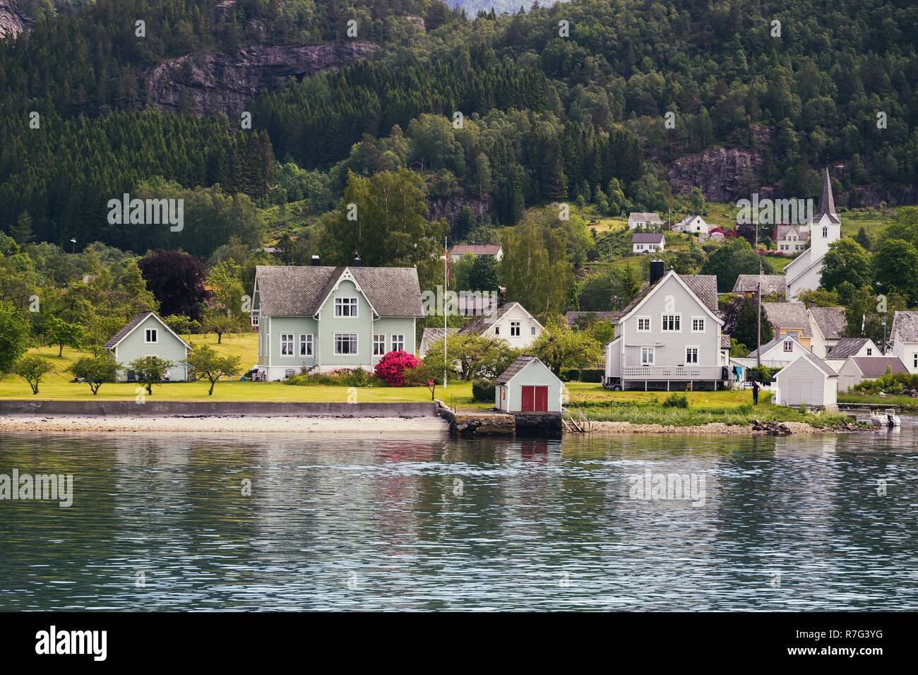 traditional norwegian wooden house to stand at the lakeside and ...